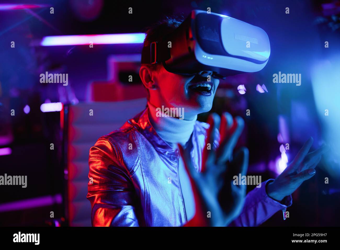 Neon metaverse futuristic concept. smiling trendy middle aged woman in ...