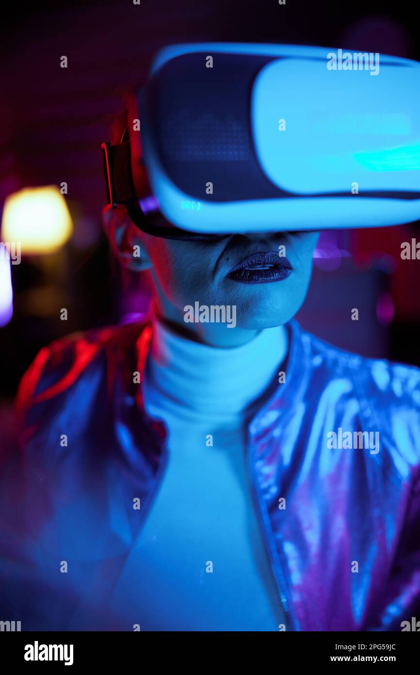 Neon metaverse futuristic concept. stylish middle aged woman in vr ...