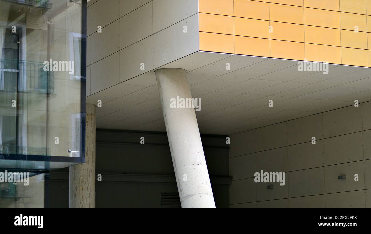 Details of facade made of aluminum panels, concrete and glass on ...