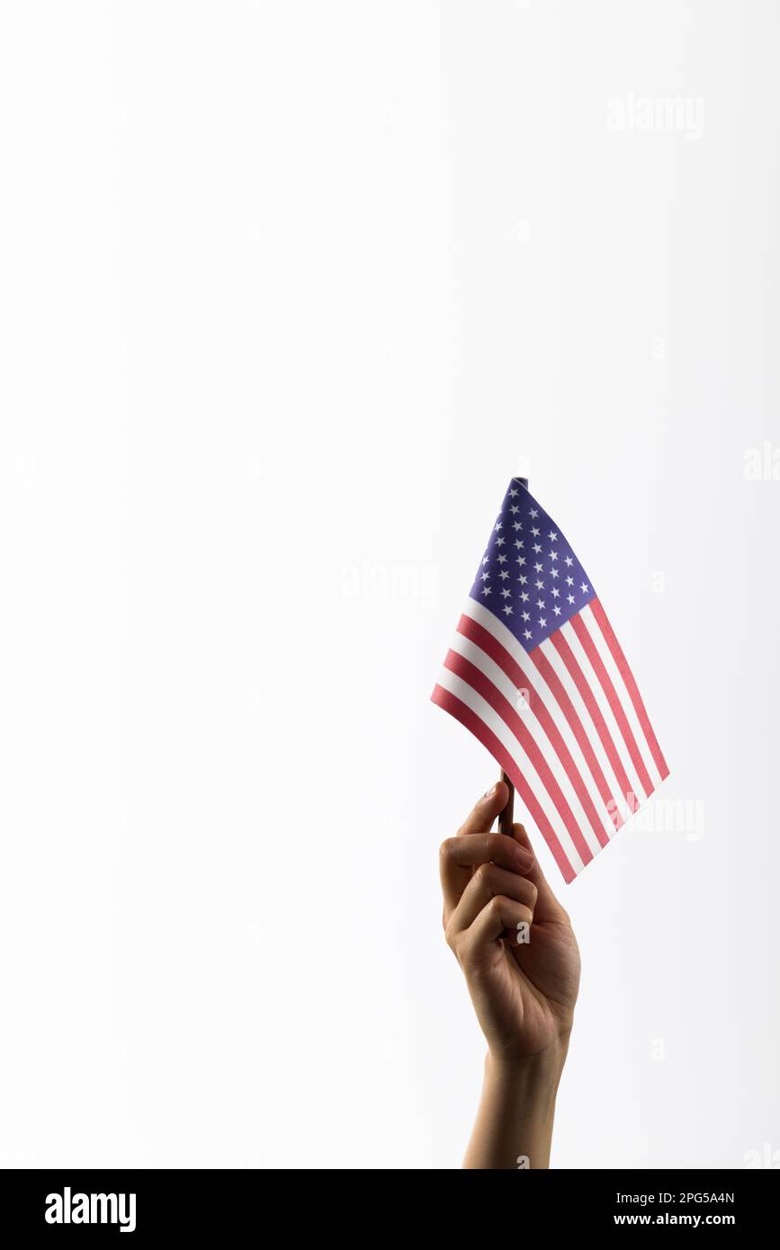 Hand holding flag pole of usa on white background with copy space Stock ...