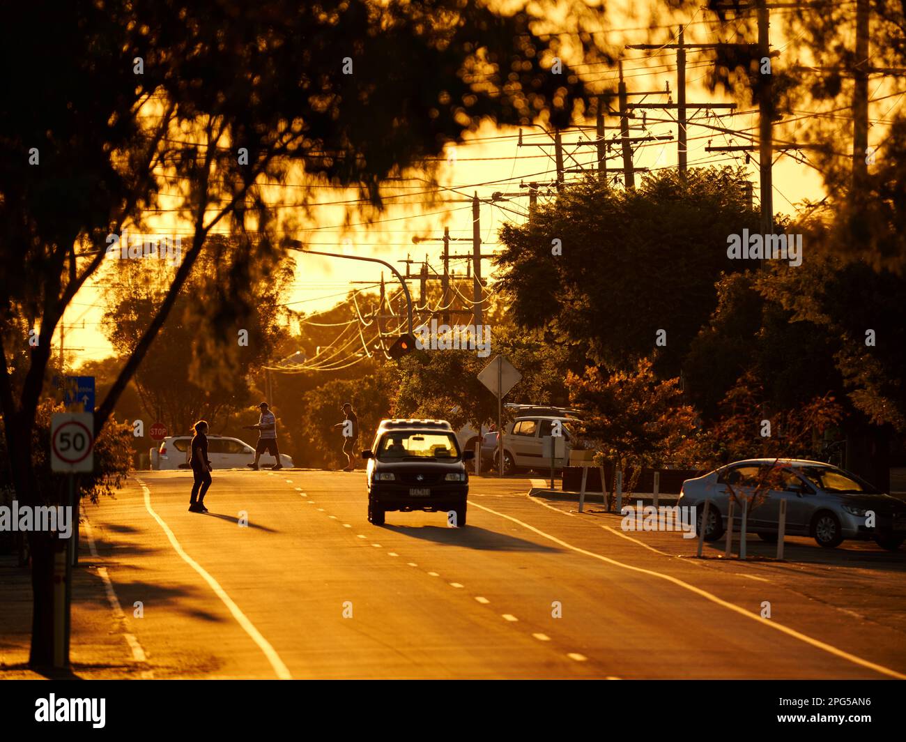 Late afternoon light illuminates the main street of a small country ...