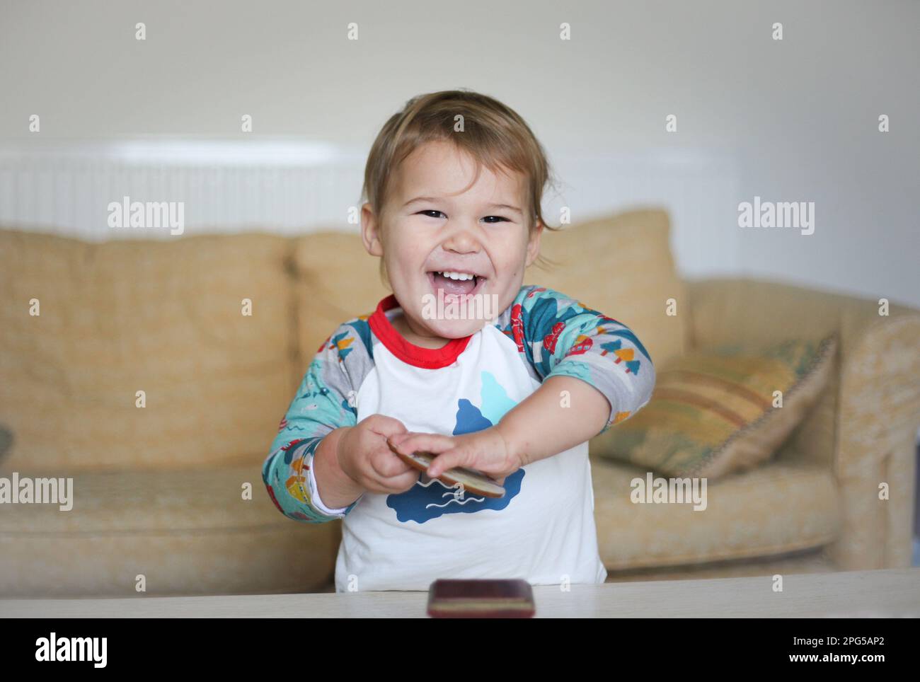 Happy toddler laughing Stock Photo - Alamy