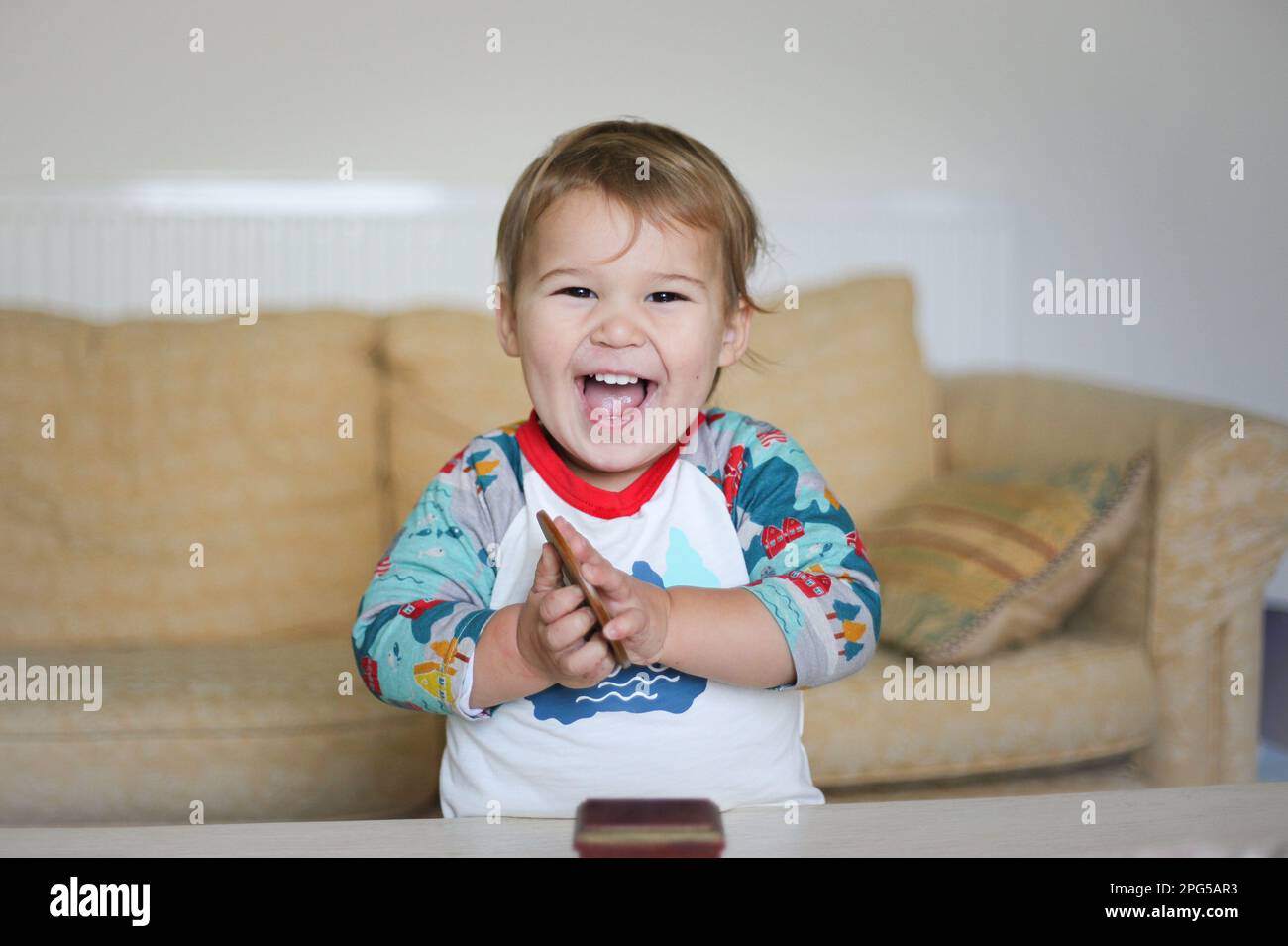 Laughing child home hi-res stock photography and images - Alamy