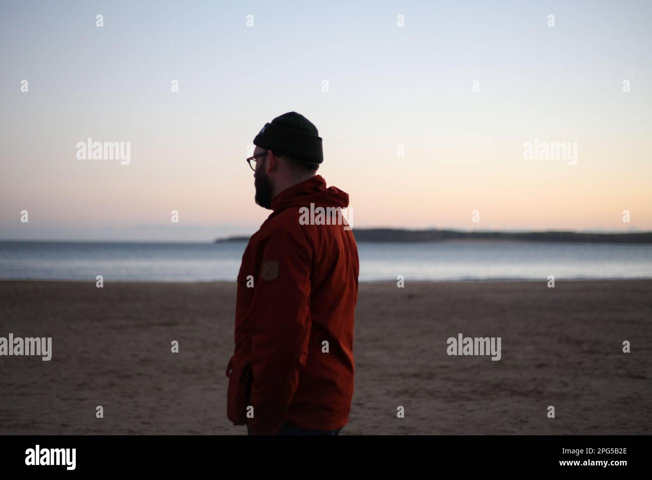 Man watching sunset at the beach hi-res stock photography and images ...