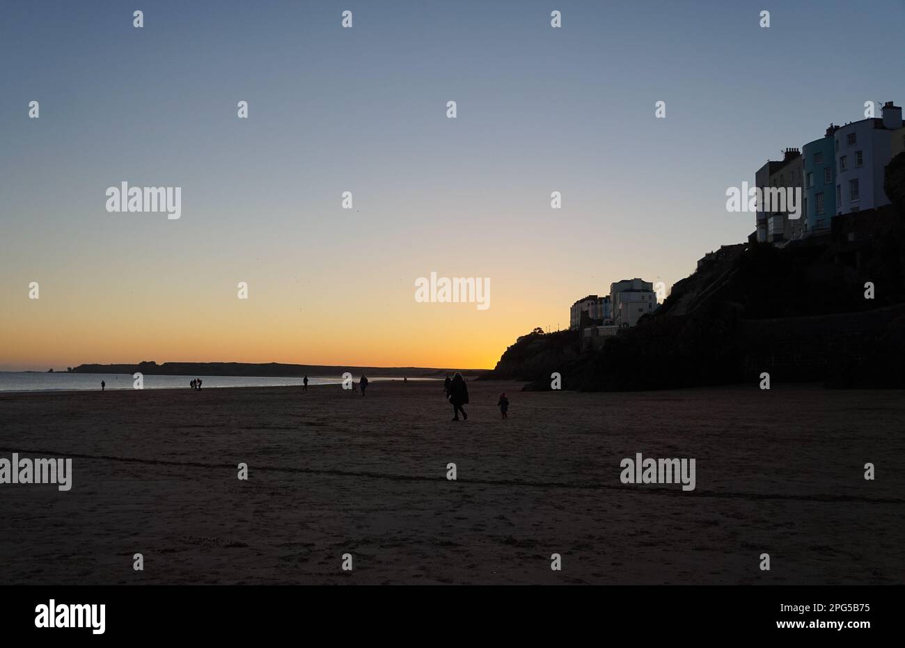 The sunset on Tenby North beach Wales Stock Photo - Alamy