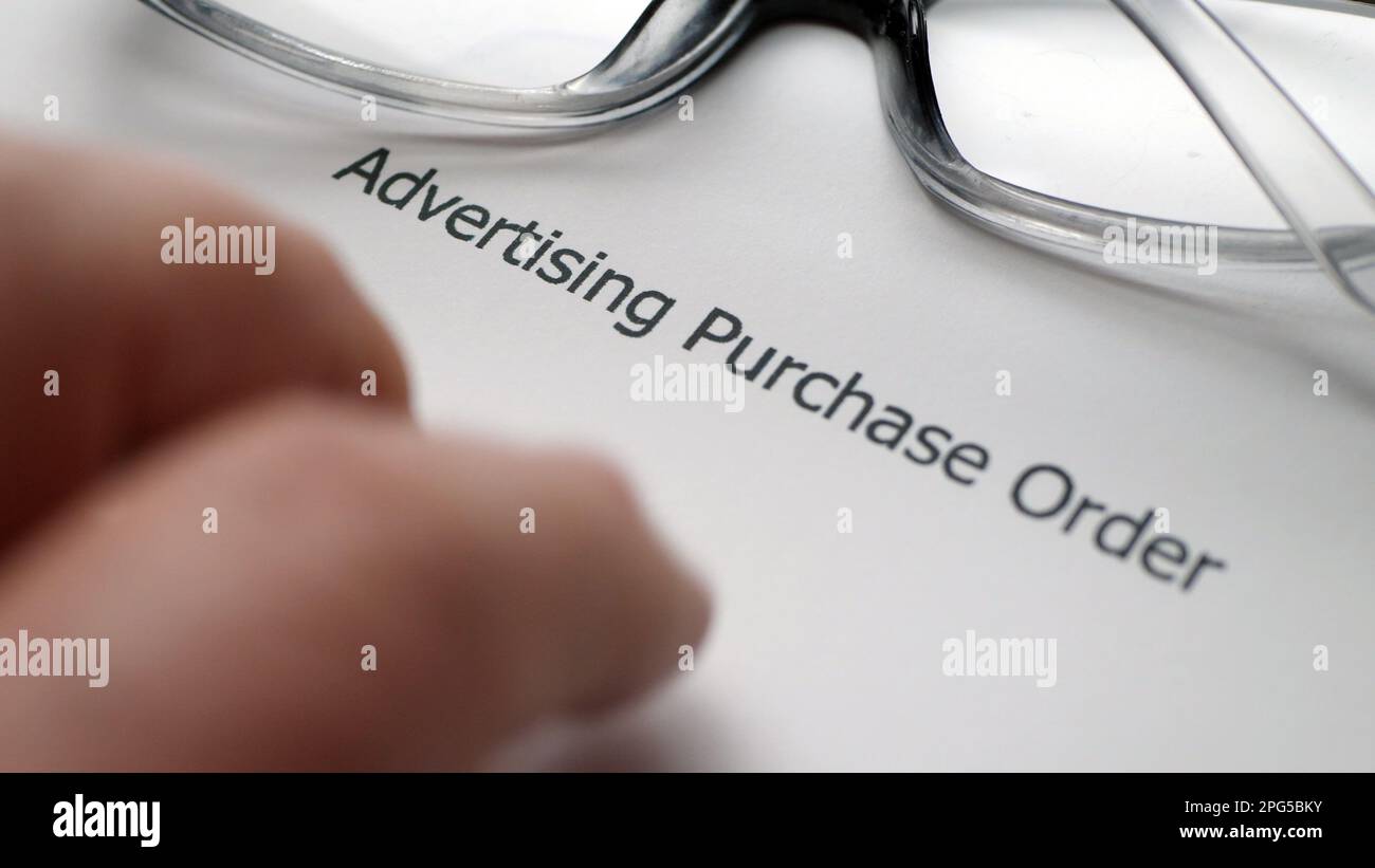 Finger tapping on advertising purchase order Stock Photo - Alamy