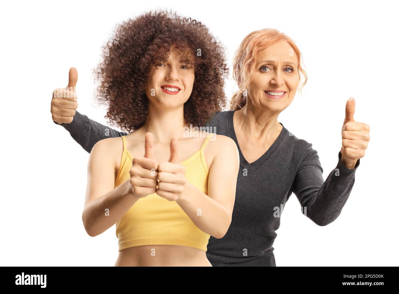 Mother and daughter showing thumbs up isolated on white background ...