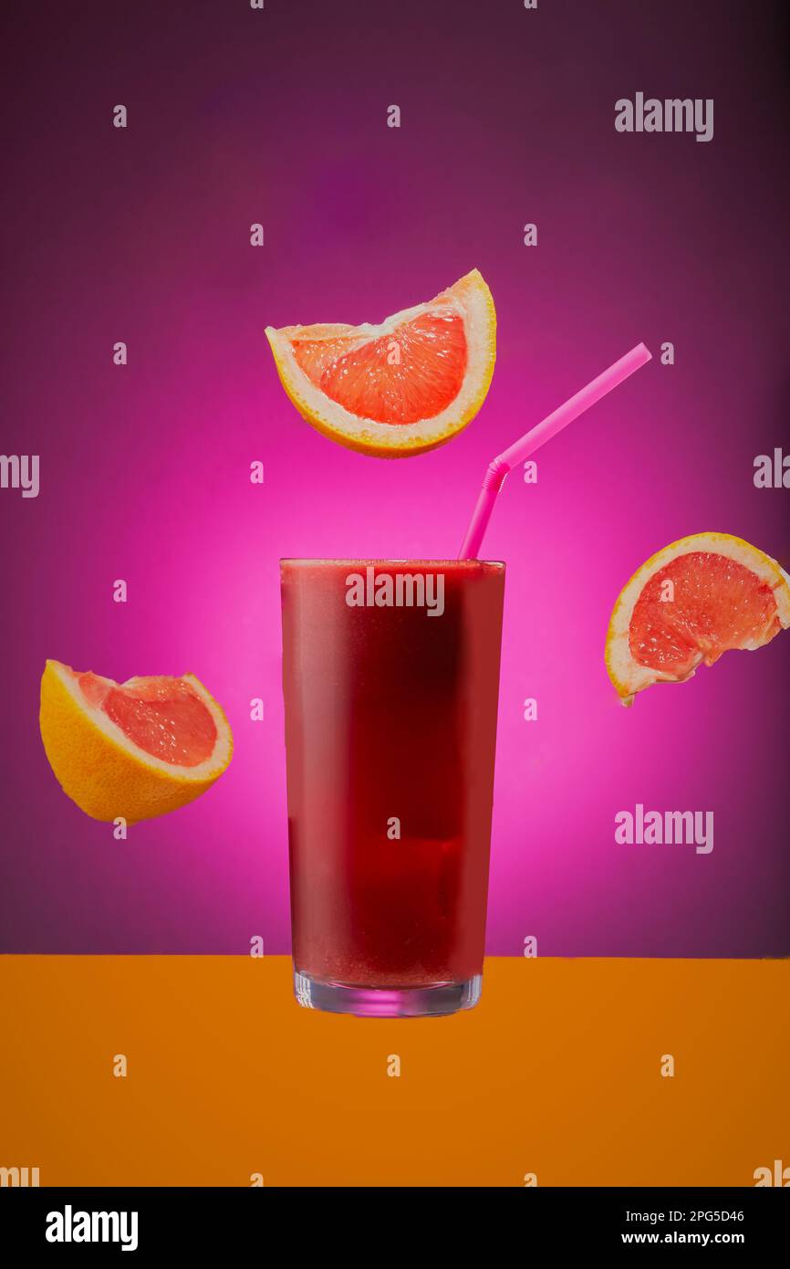 Grapefruit drink isolated on a purple gradient background Stock Photo ...