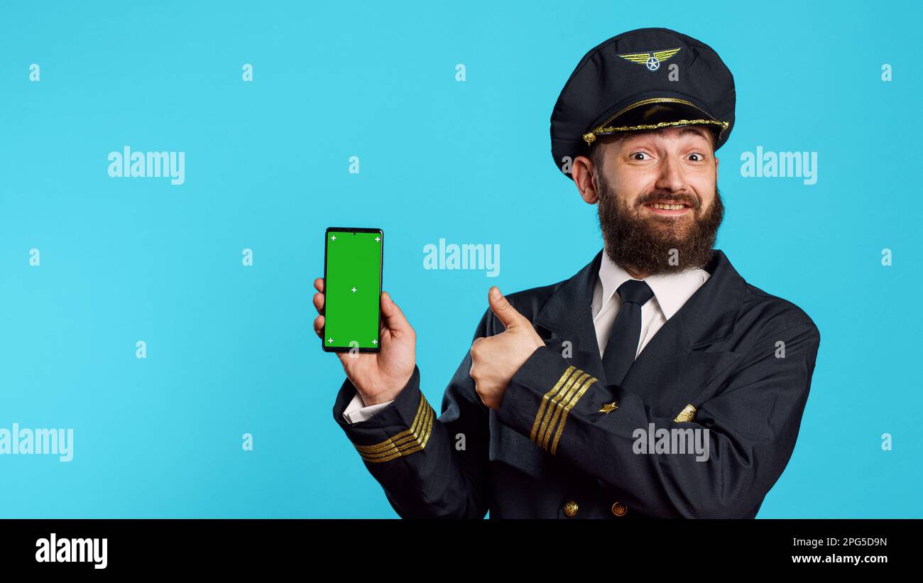 Smiling male aviator using telephone hi-res stock photography and ...