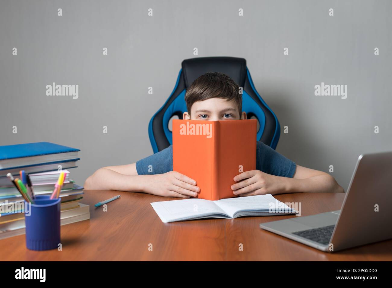 Hide behind open book hi-res stock photography and images - Alamy