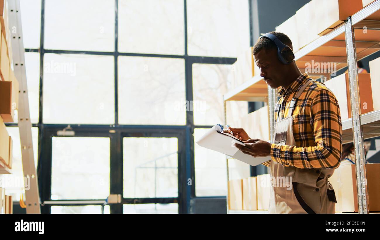 African american person singing and dancing in warehouse, having fun ...