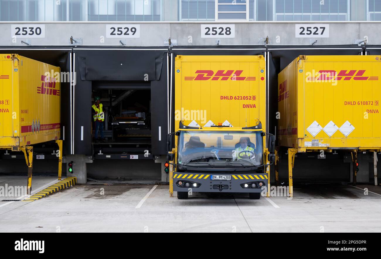 Aschheim, Germany. 20th Mar, 2023. Containers and vehicles with the DHL ...