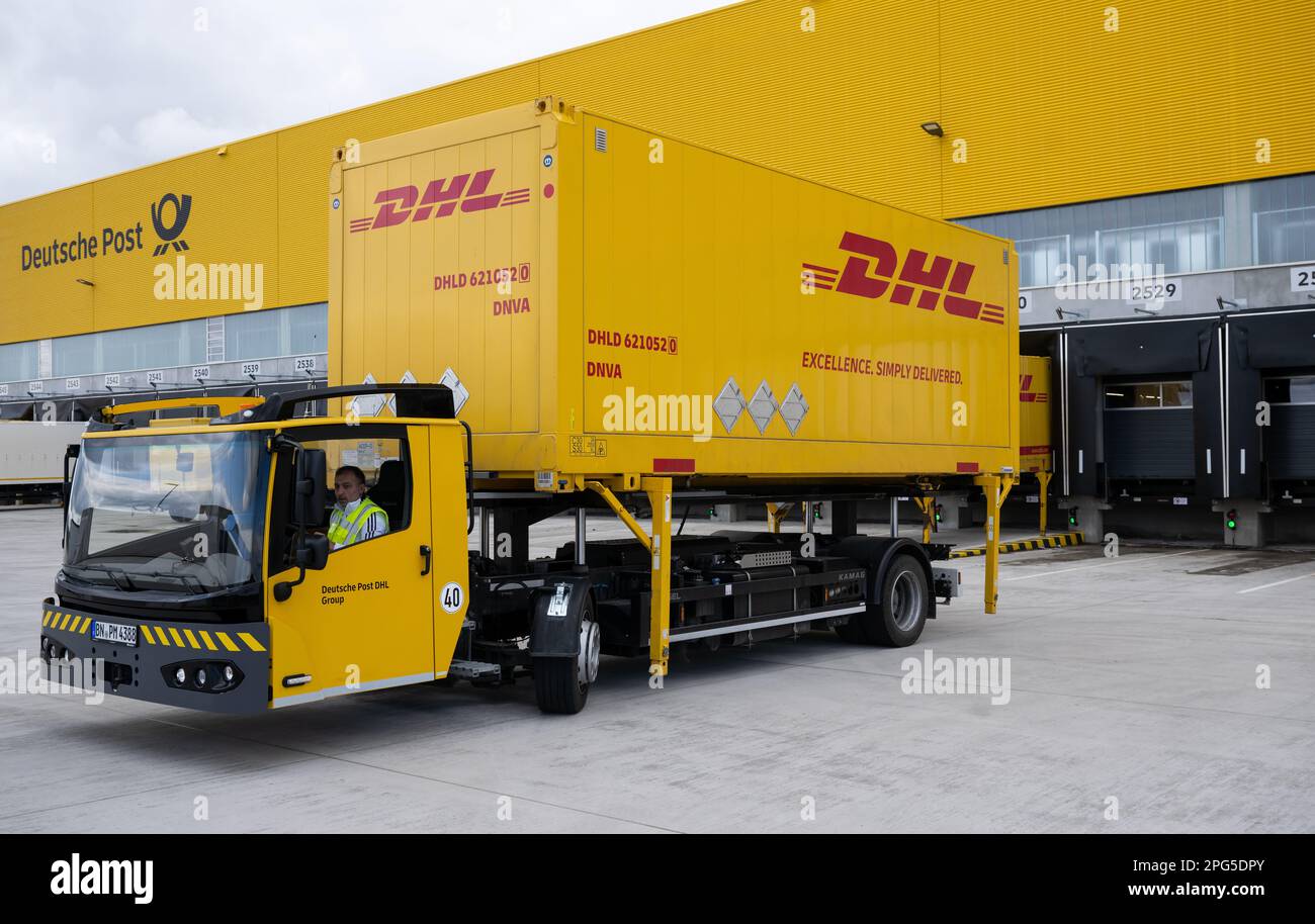 Aschheim, Germany. 20th Mar, 2023. Containers and vehicles with the DHL ...