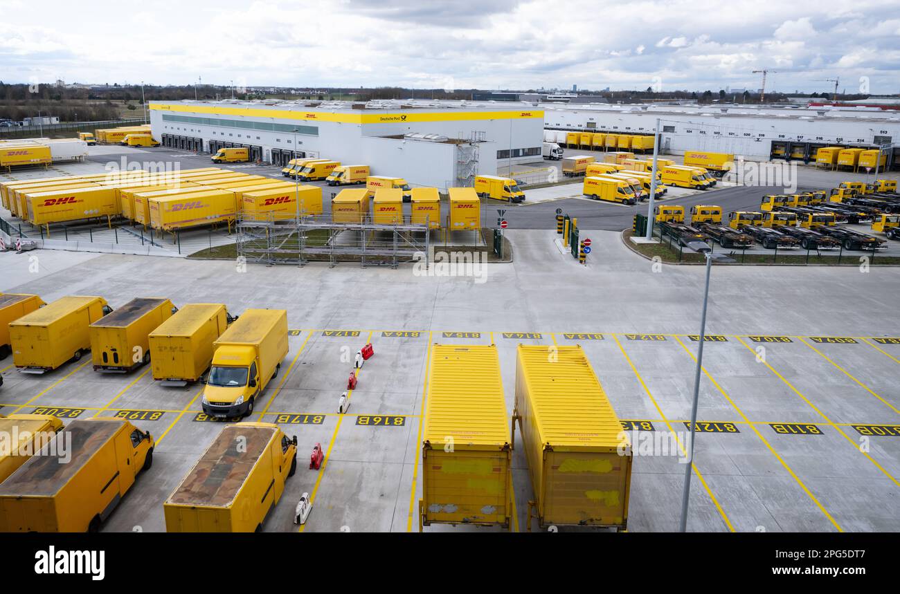 Aschheim, Germany. 20th Mar, 2023. Containers and vehicles with the DHL ...