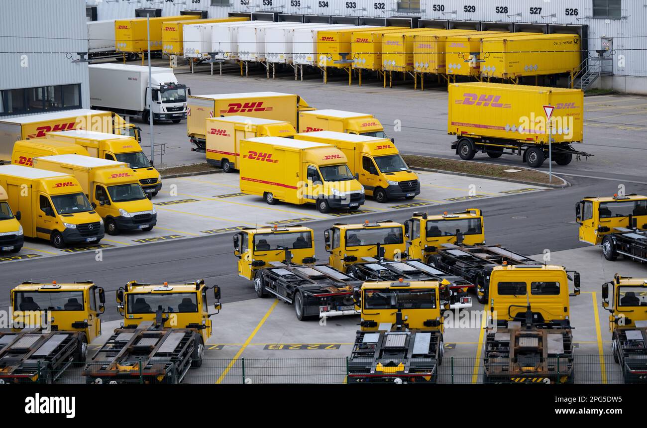 Aschheim, Germany. 20th Mar, 2023. Containers and vehicles with the DHL ...