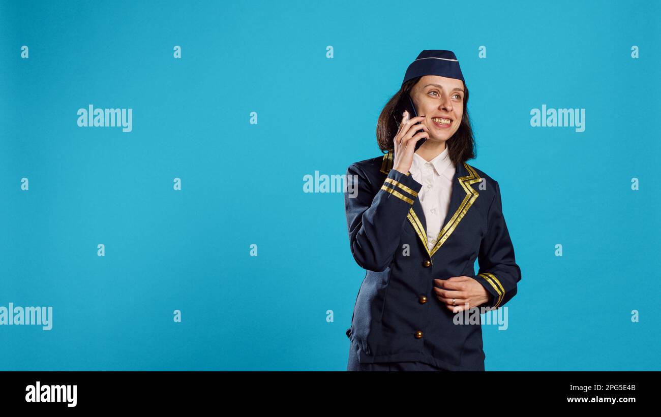 Young airliner chatting on mobile phone call and having fun, feeling ...