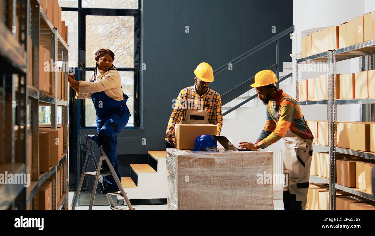African american employees arranging merchandise hi-res stock ...