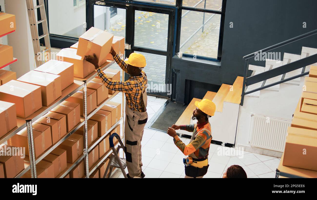 Group of workers working on stock inventory in depot, organizing ...