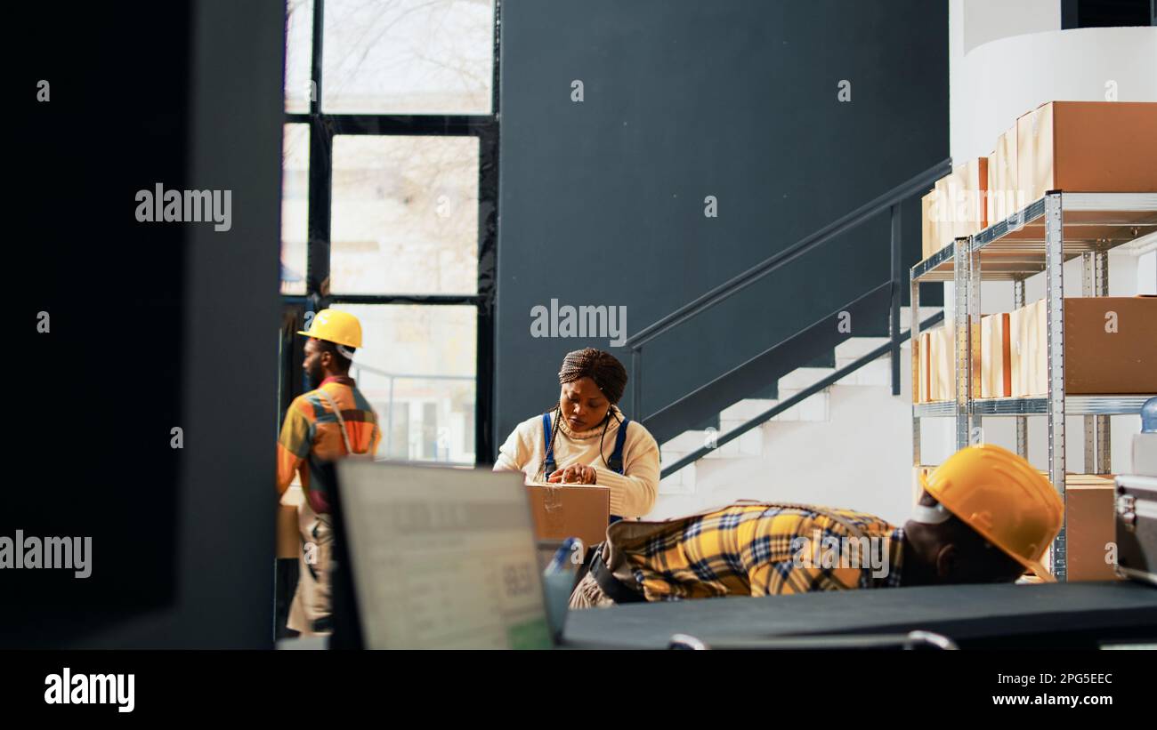 Woman stacking shelves hi-res stock photography and images - Alamy