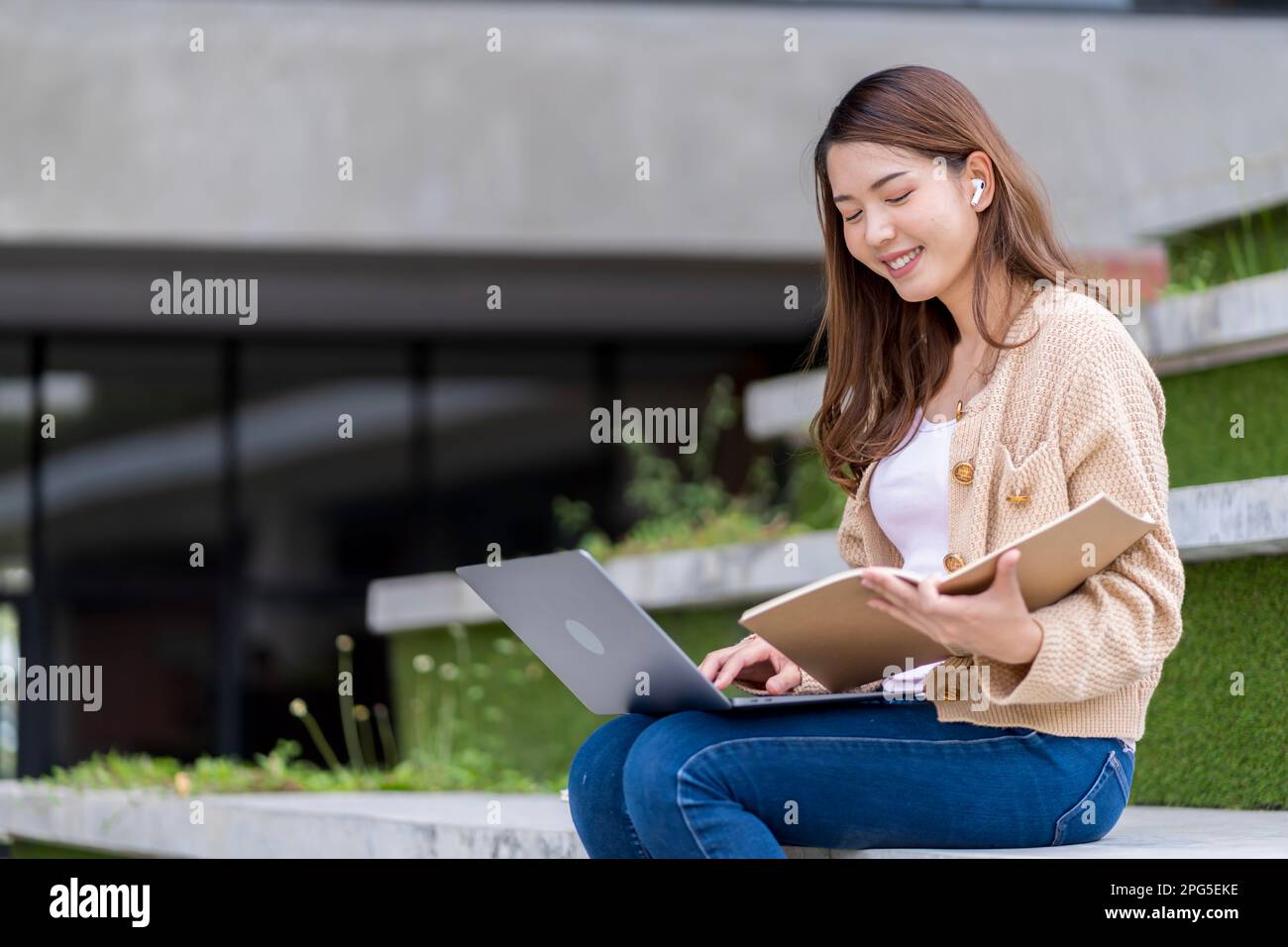 Asian female student Studying for exams in the area of the university ...