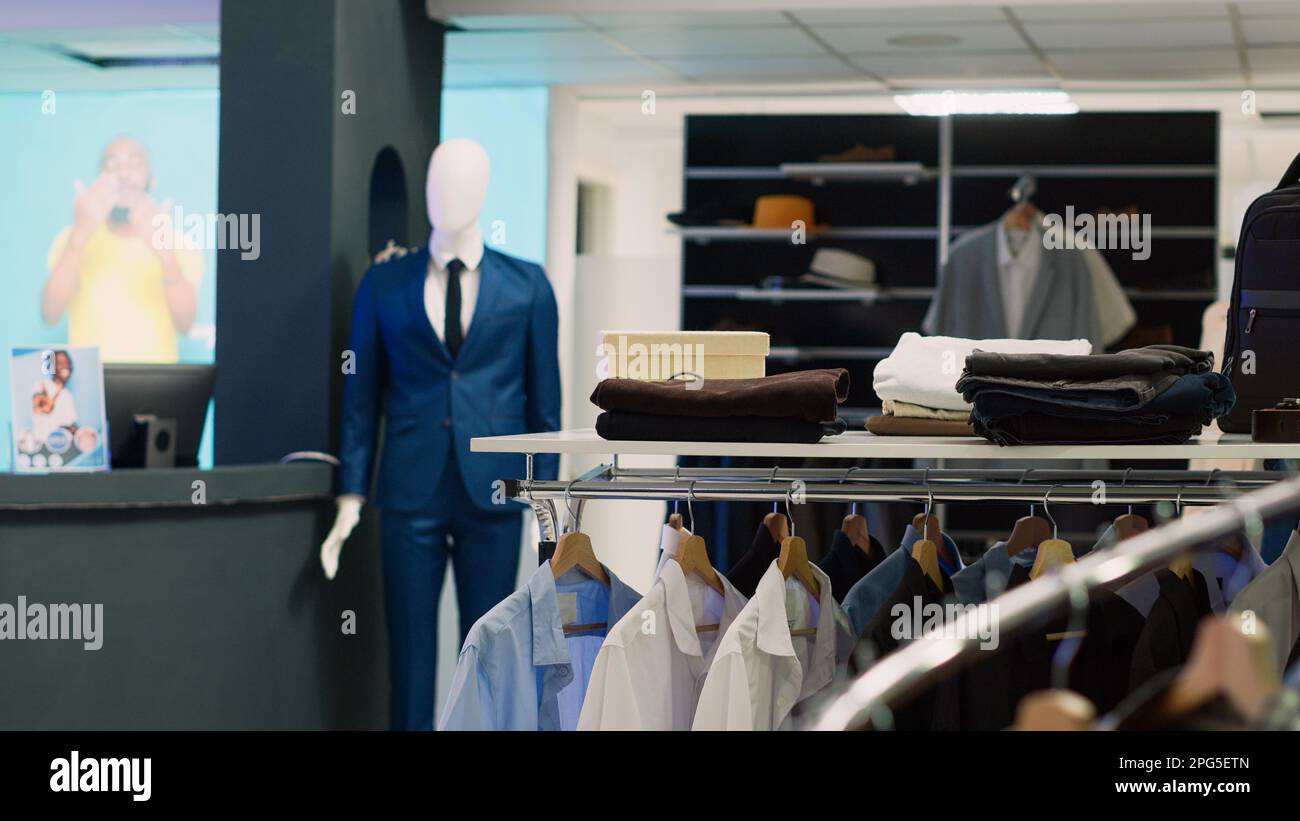 Empty clothing store with casual and formal wear design, retail shop ...