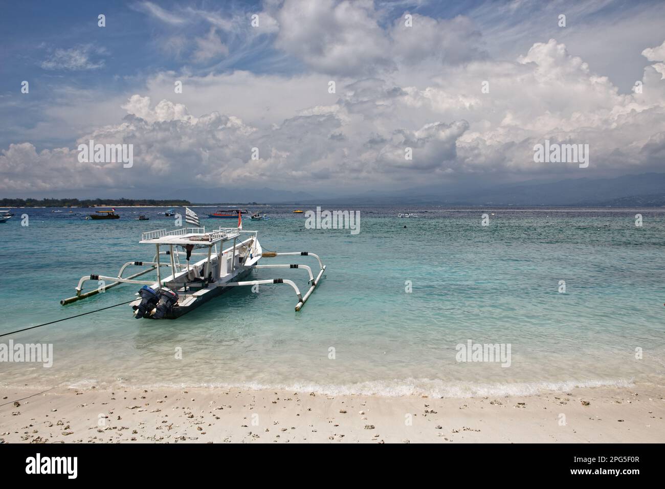 The sandy beach of Gili Trawangan, with Lombok Island in the background ...