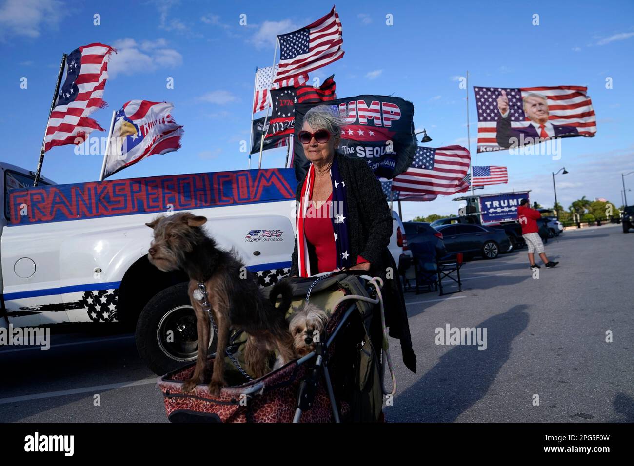 Paula Magnuson, a supporter of former President Donald Trump, walks ...