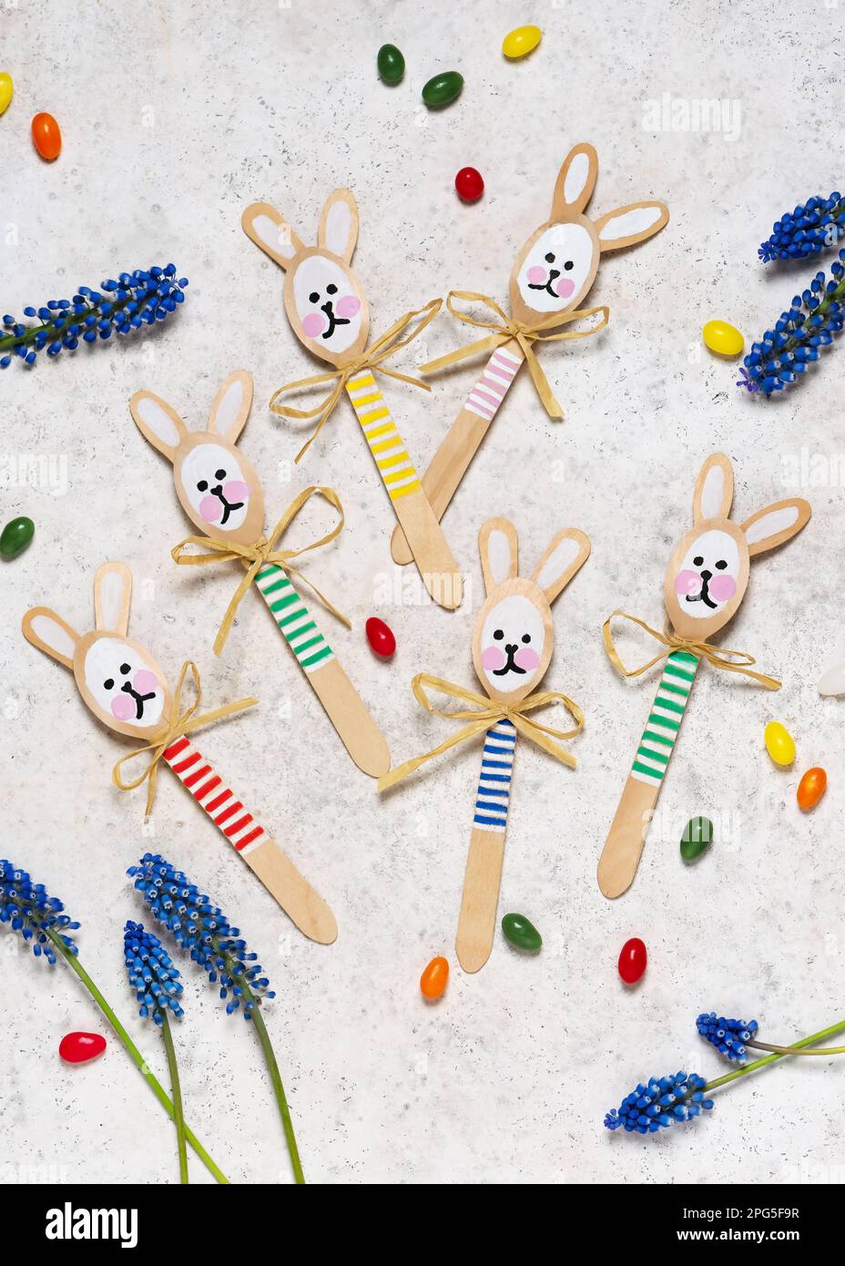 Topf view of handmade cute colorful rabbits made from wooden spoons ...