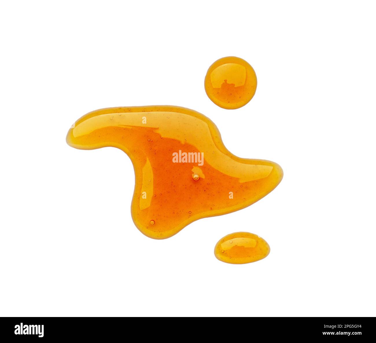 Spilled maple syrup on white background Stock Photo - Alamy