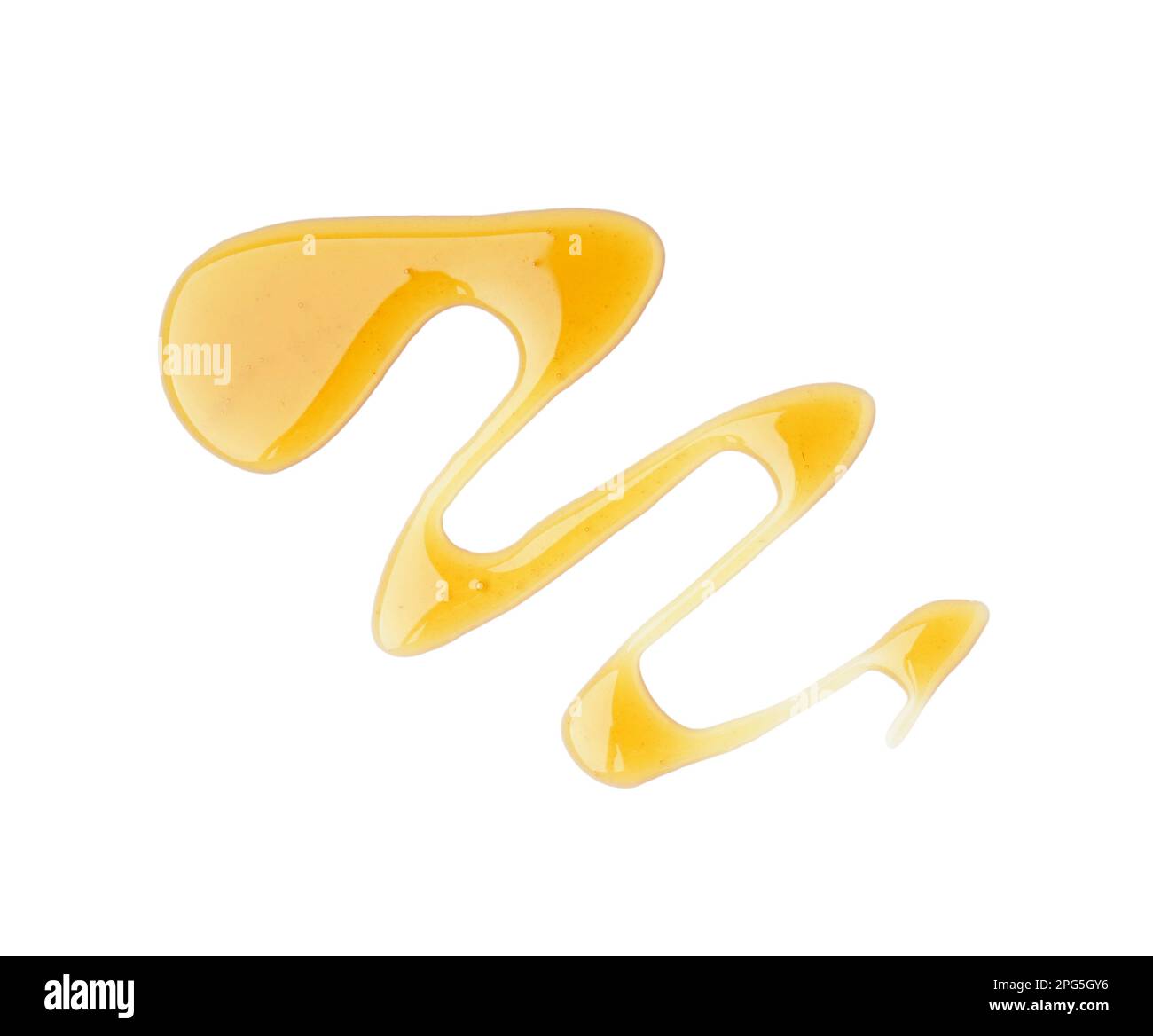 Spilled maple syrup on white background Stock Photo - Alamy