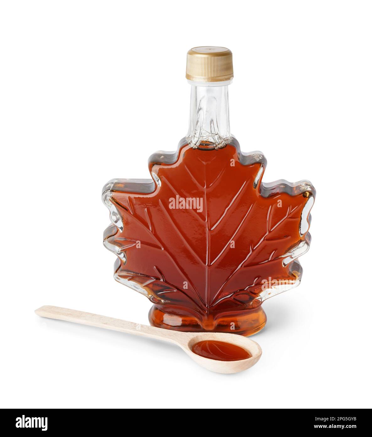 Bottle and spoon of tasty maple syrup on white background Stock Photo ...