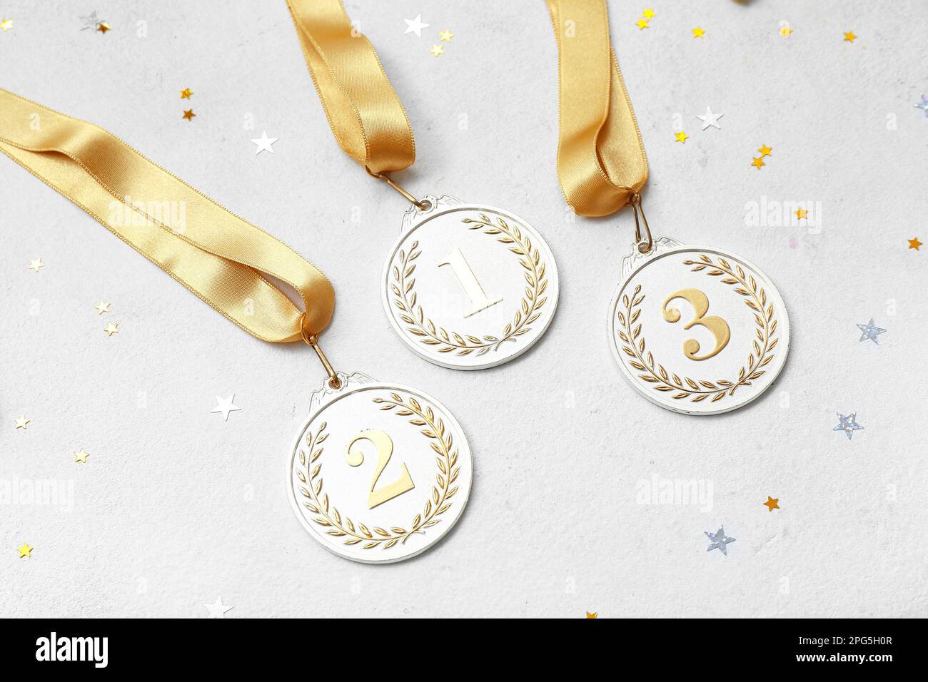 Prize medals with stars on white background, closeup Stock Photo - Alamy