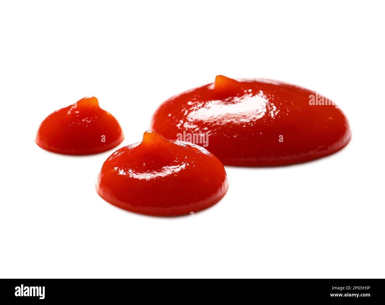 Drops of tasty ketchup isolated on white background Stock Photo - Alamy