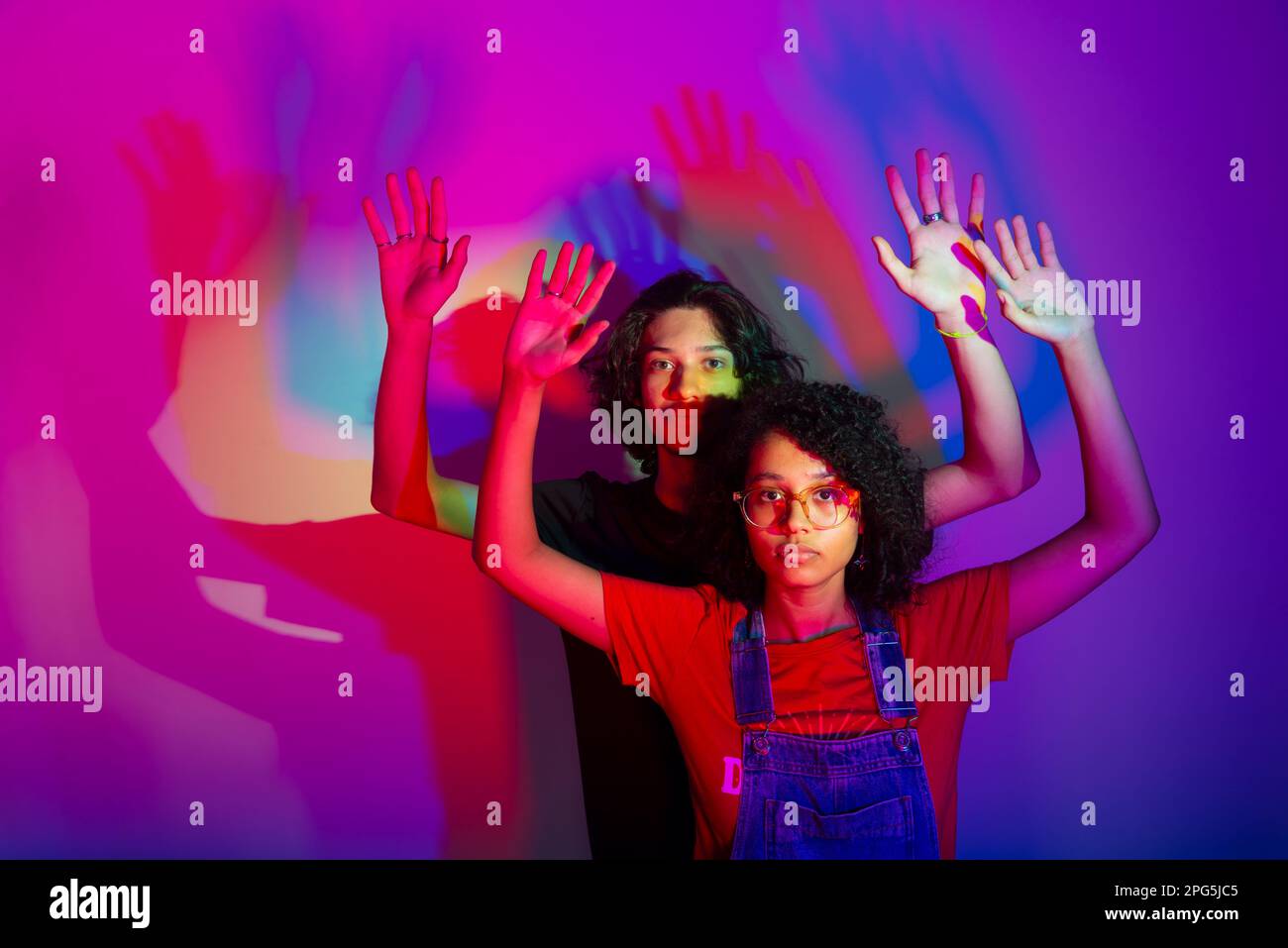 Portrait of two young lovers, isolated on background with colored ...