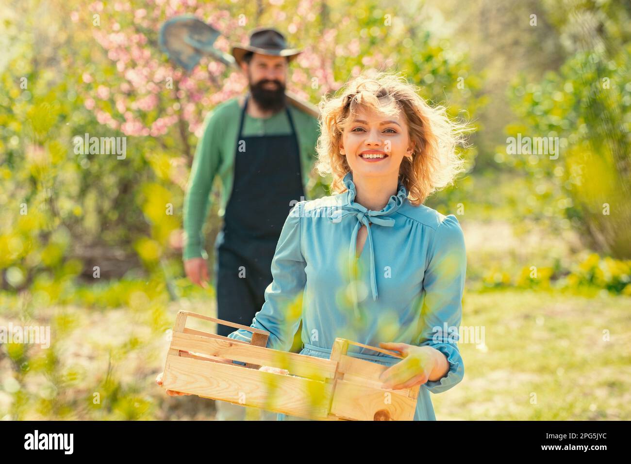Small business owner selling organic fruits and vegetables. Two people ...