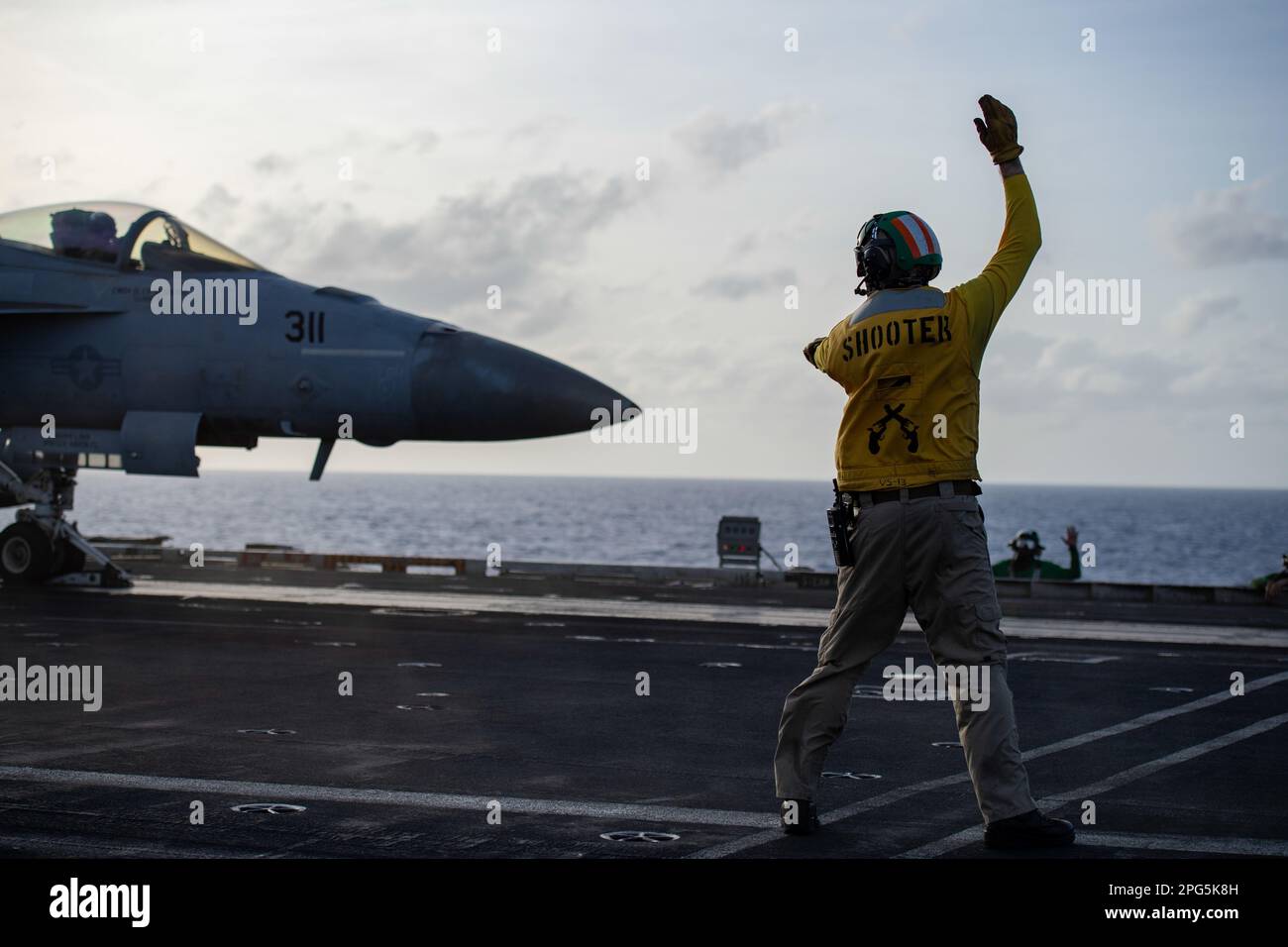 230316-N-WM182-3035 PHILIPPINE SEA (March 16, 2023) A U.S. Navy Sailor prepares to launch an F/A ...