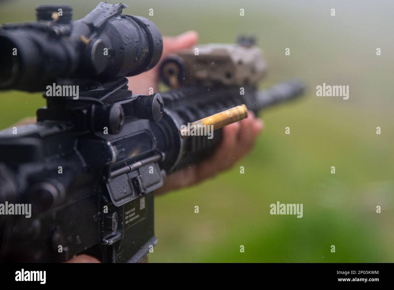 A U.S. Marine in the ANGLICO Basic Course fires an M4 service rifle ...