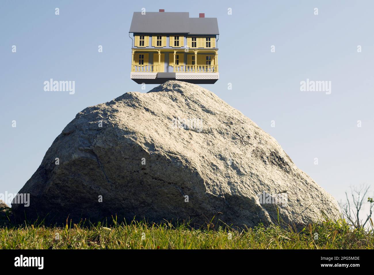 model house on top of a boulder Stock Photo - Alamy