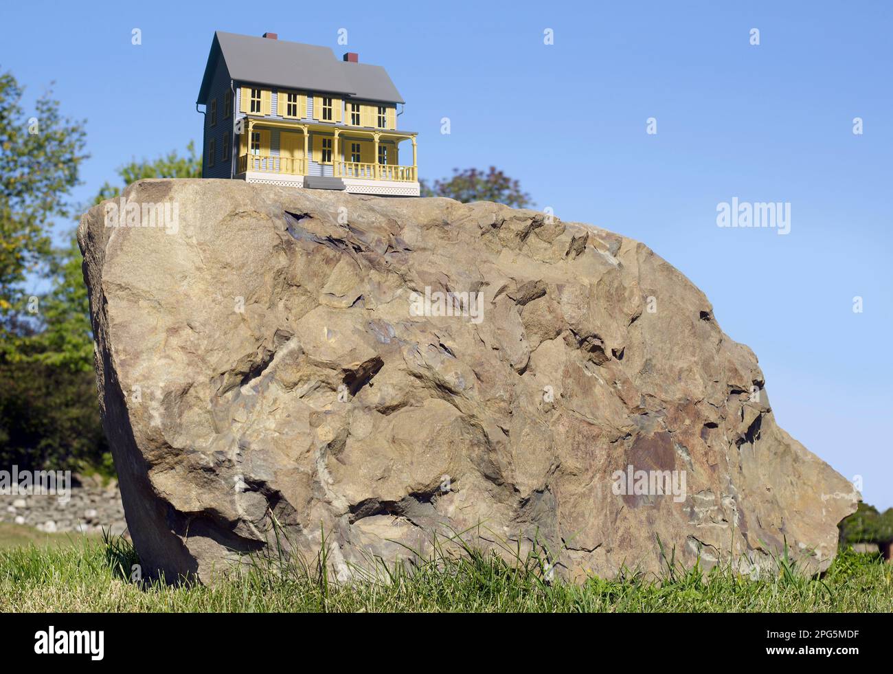 model house on top of a boulder Stock Photo - Alamy