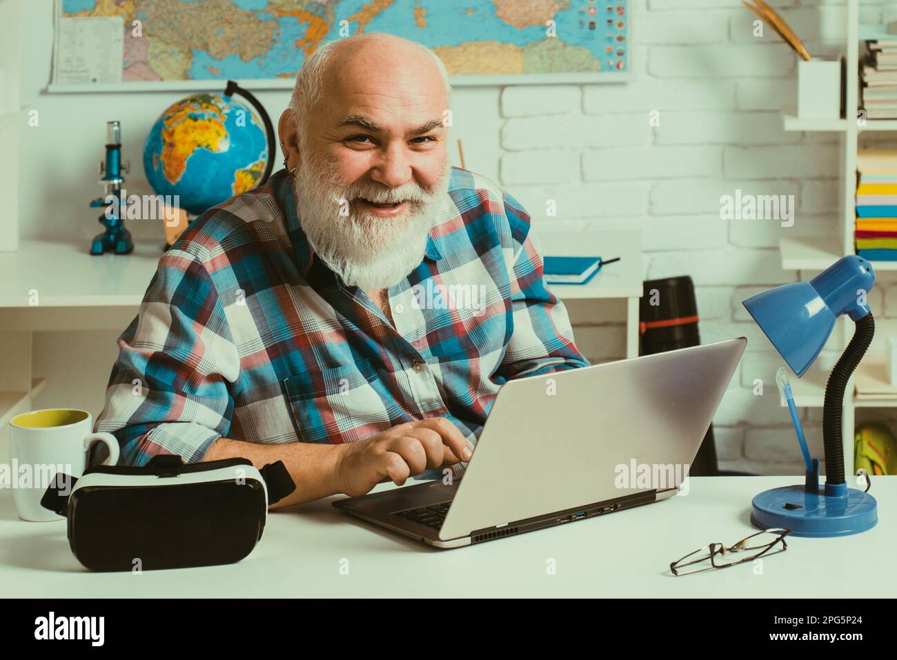 Senior teacher in classroom. A happy teacher is easy to learn ...