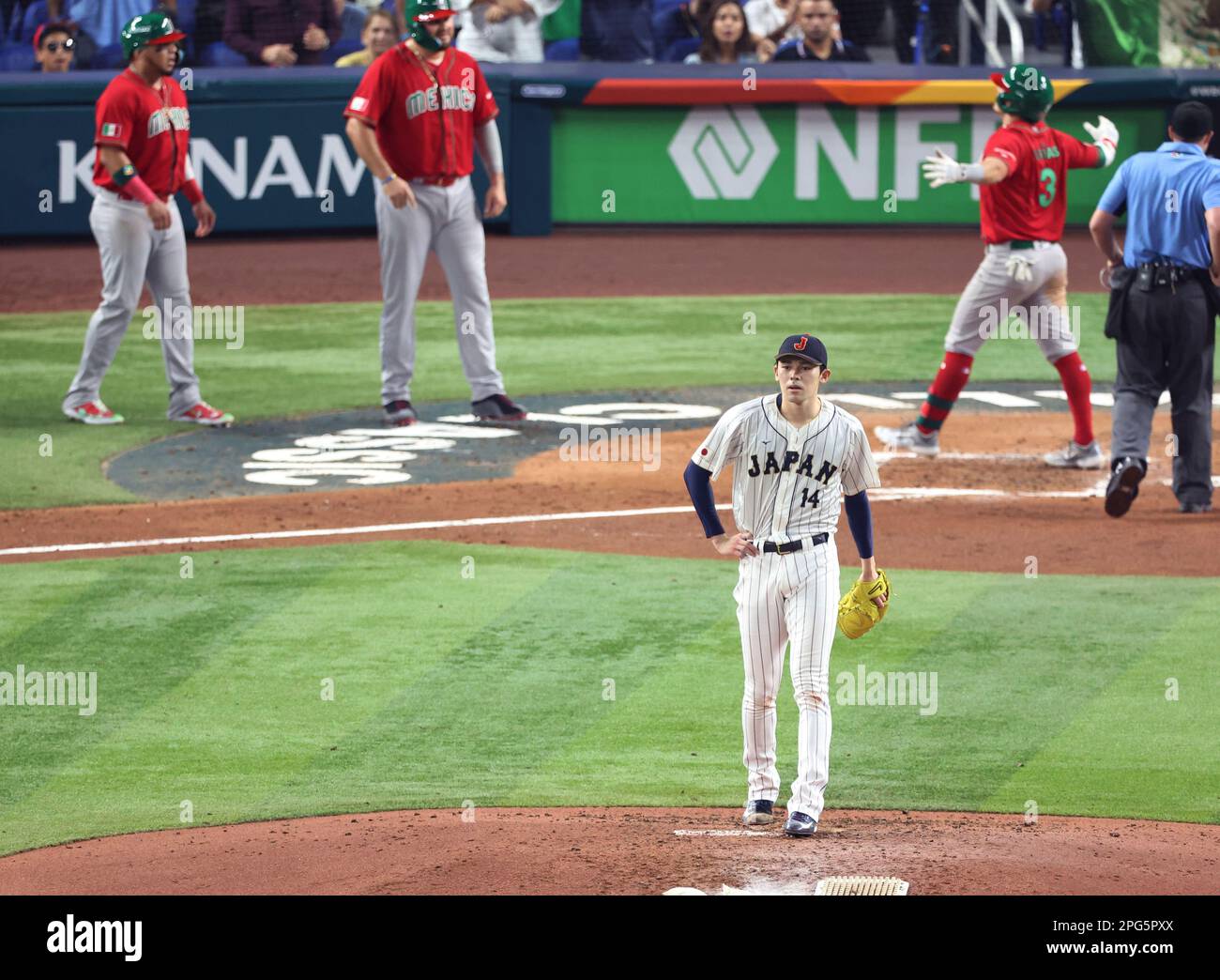 Roki Sasaki of Japan is hit three-run homer by Luis Urias of Mexico in ...
