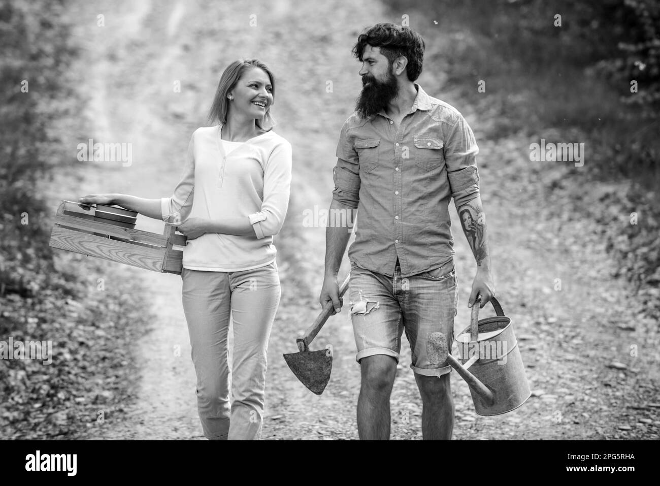 Bio food production concept. Farmars couple enjoy spring nature and ...