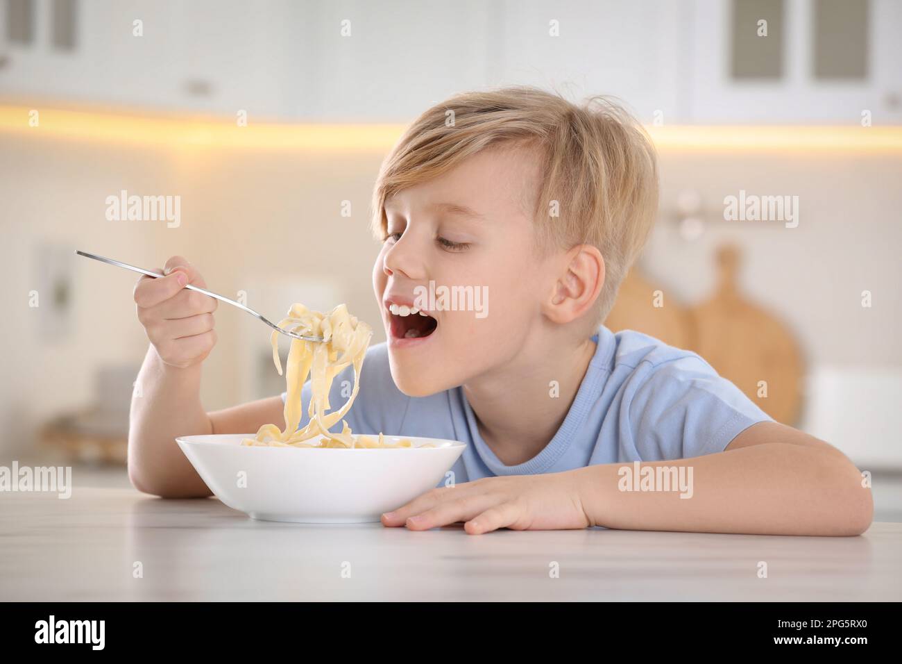 Boy eat pasta hi-res stock photography and images - Alamy