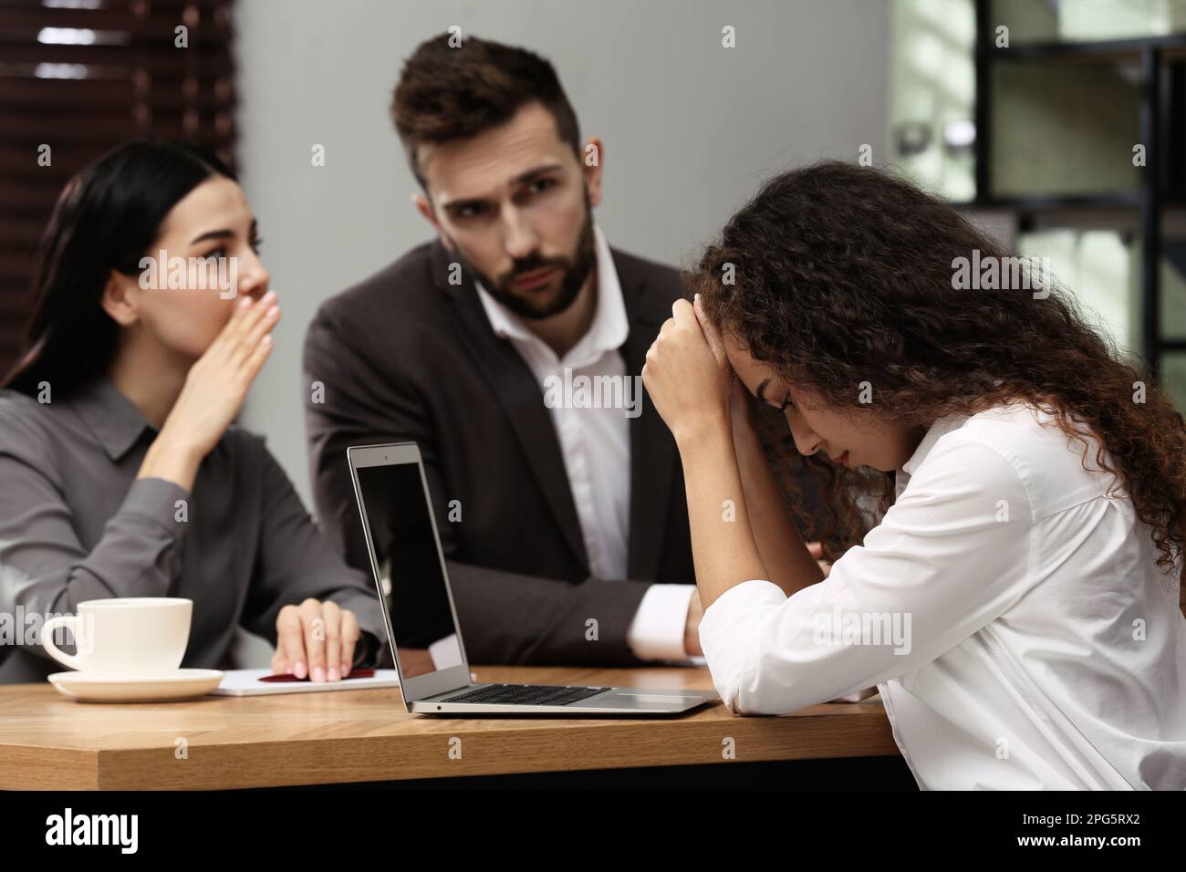 African American woman suffering from racial discrimination at work ...