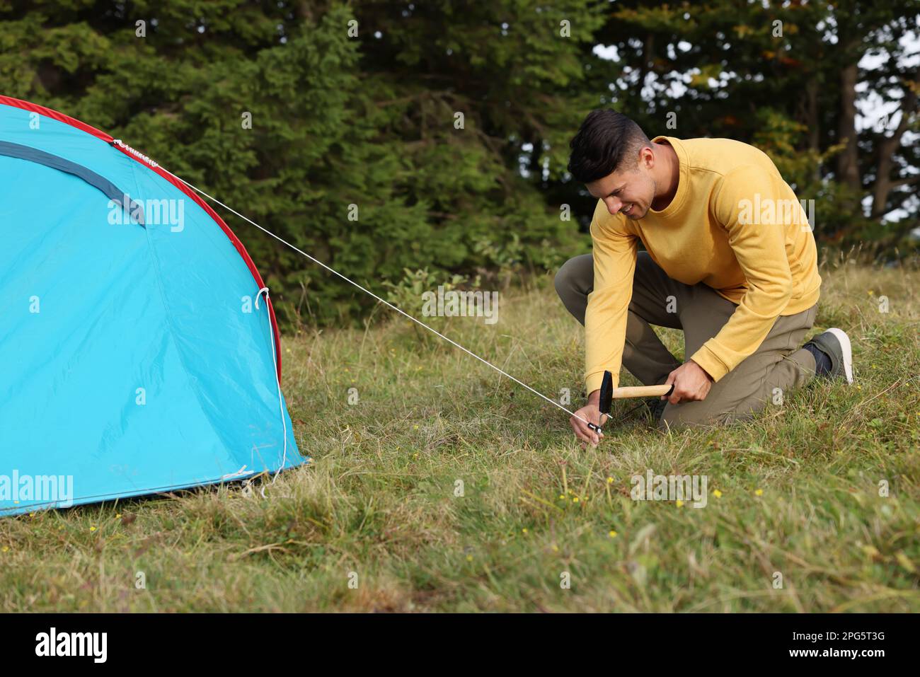 Happy man setting up hi-res stock photography and images - Alamy
