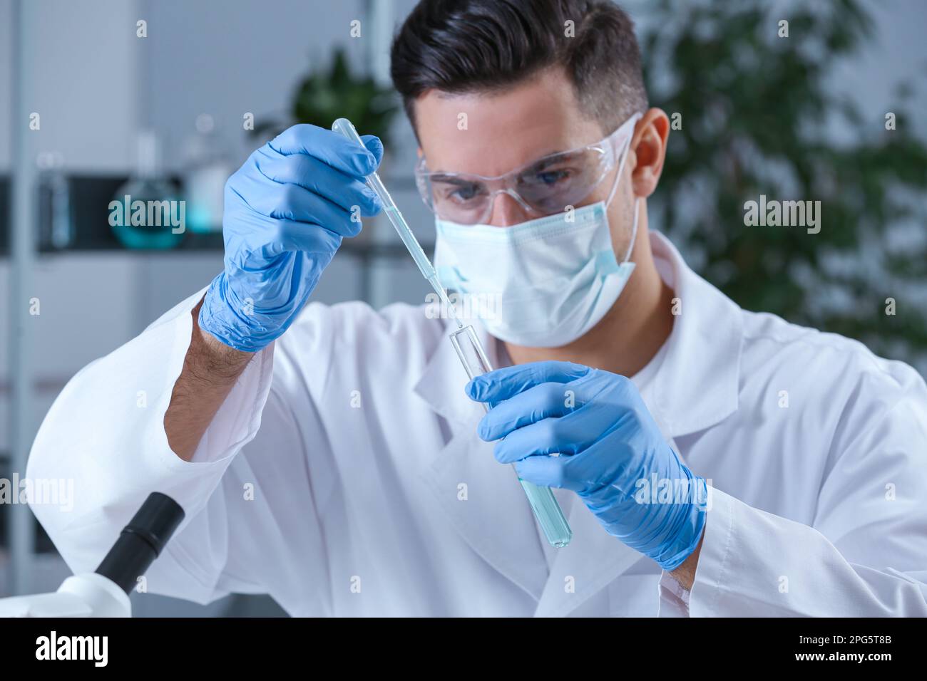 Scientist working with sample in chemical laboratory Stock Photo - Alamy