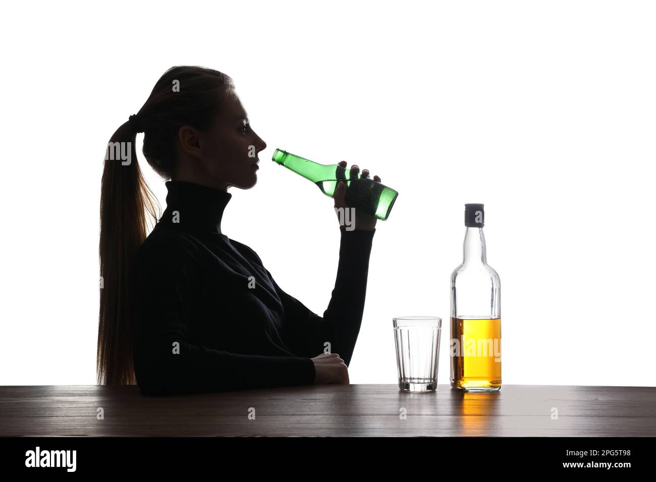 Alcohol addiction. Woman drinking beer on white background Stock Photo ...