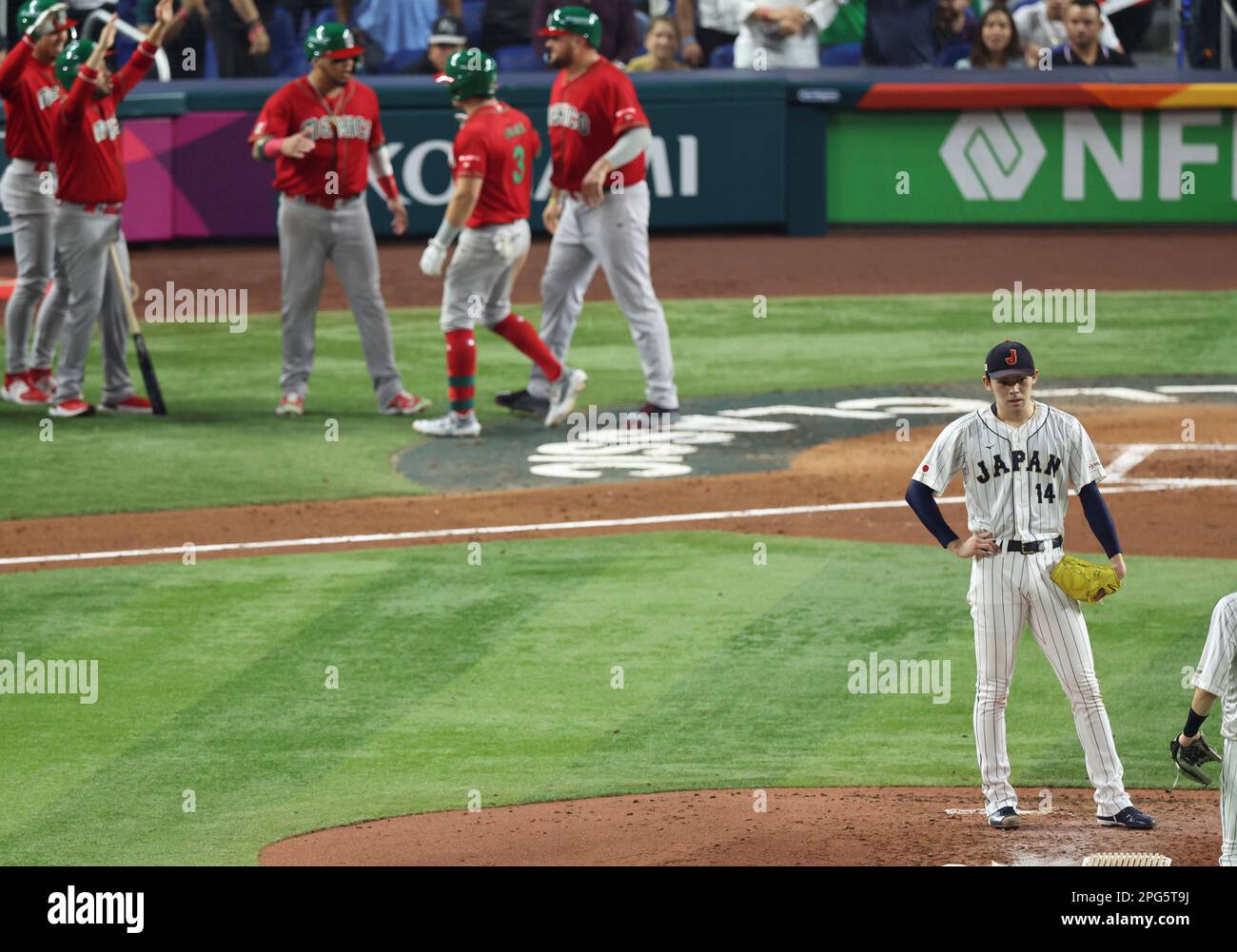 Roki Sasaki of Japan is hit three-run homer by Luis Urias of Mexico in ...