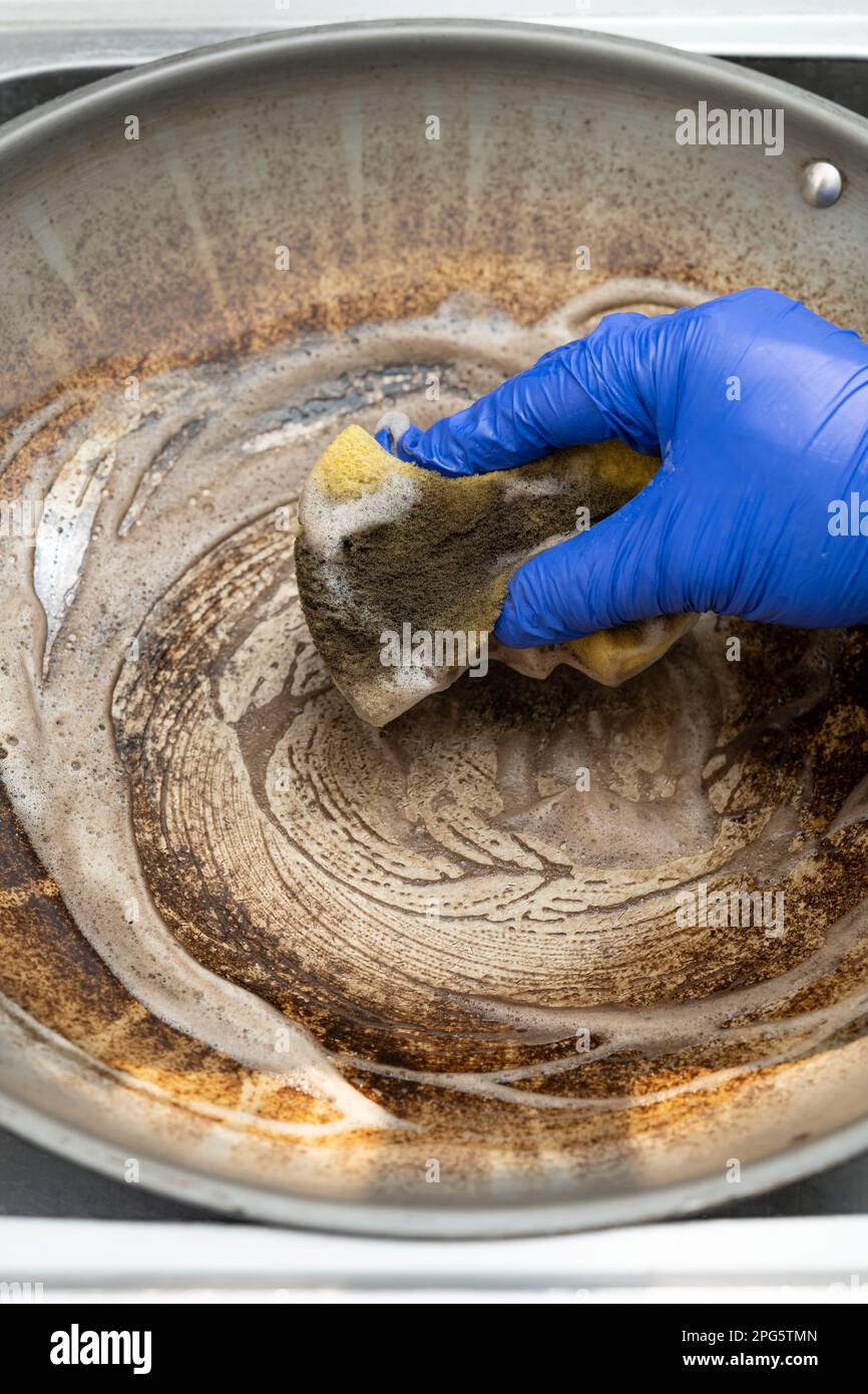 Cleaning cooking pot hi-res stock photography and images - Alamy
