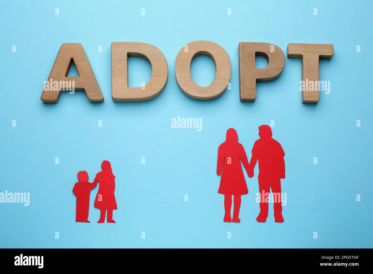 Figures of parents with children and word Adopt on light blue ...